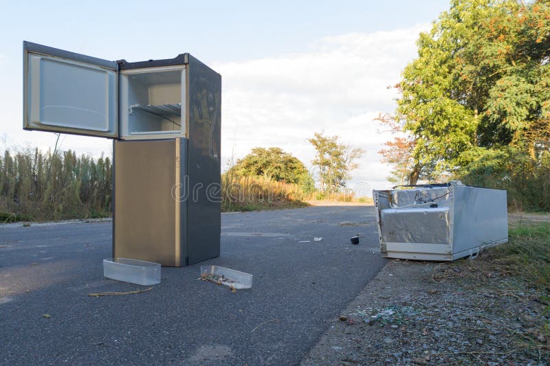 Discarded Refrigerator and Broken Appliance on the Roadside Stock Photo ...
