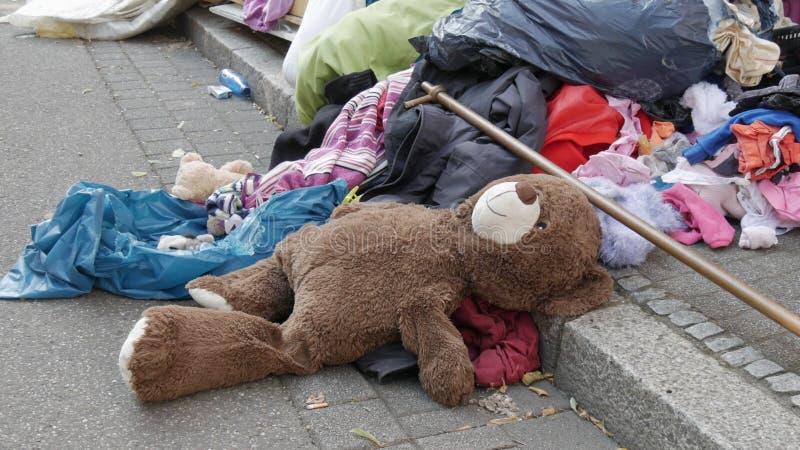 A Discarded Soft Toy Bear Lies on the Street on a Garbage Heap Stock ...