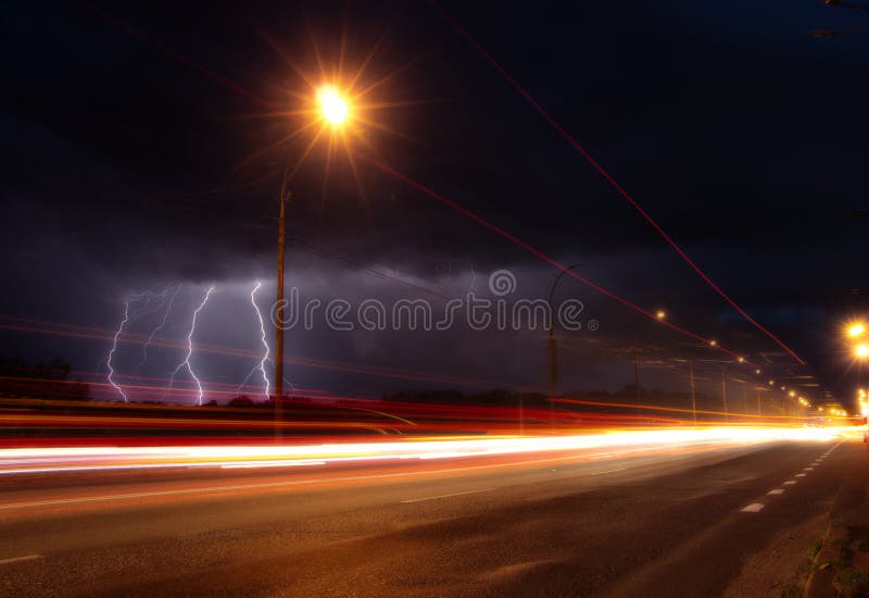 Discharges of Lightning in the Night Sky Over the Road Stock Image ...