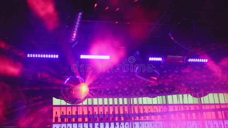Disco Ball with Multicolored Rays on the Background of a Bar Counter in ...