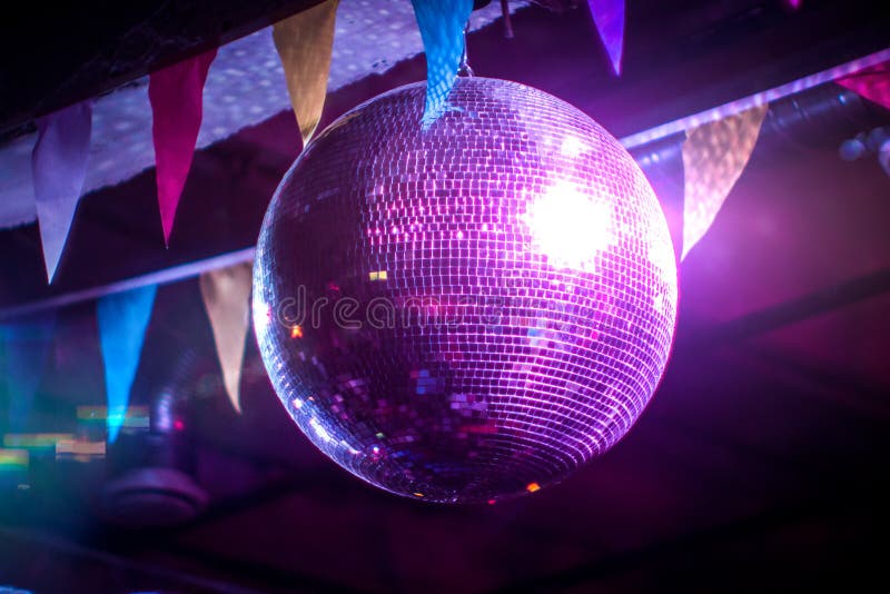 Disco Ball at the Party. Beautiful Purple Light, the Rays Reflected ...