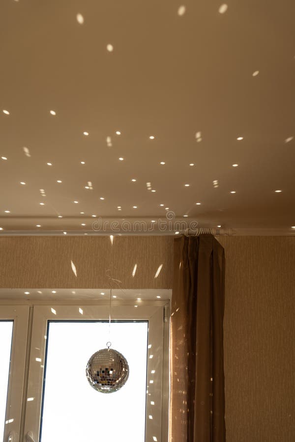 Disco Ball Reflecting Light on Ceiling in Interior Room Stock Photo ...