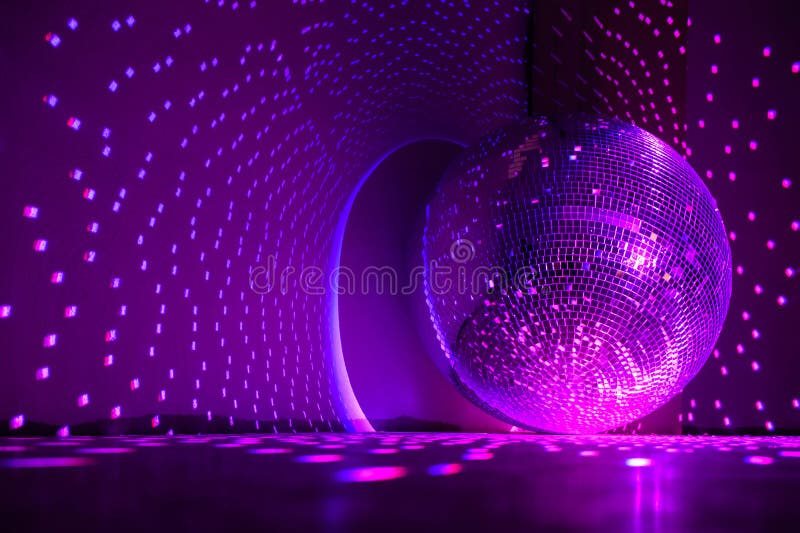 Disco Ball Reflecting Purple Light in a Dark Hall. Disco Symbol Stock ...