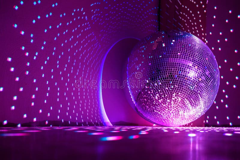 Disco Ball Reflecting Violet or Purple Light in a Dark Hall. Copy Space ...
