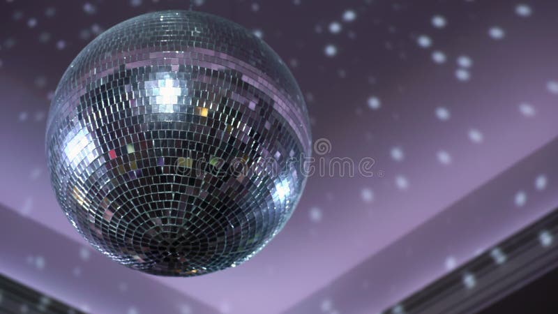 A Disco Ball Suspended from the Ceiling Rotates Quickly, Light Rays and ...