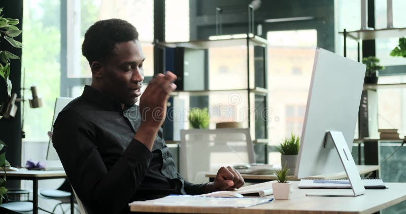 Discontented Black Office Worker at Desk in the Office Stock Footage ...