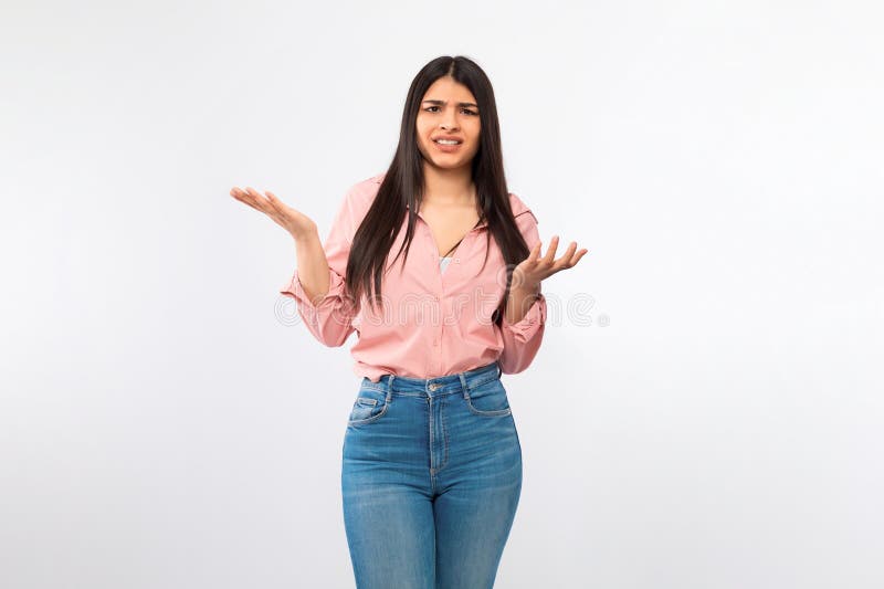 Discontented Young Lady Shrugging Shoulders Standing Over White Studio ...