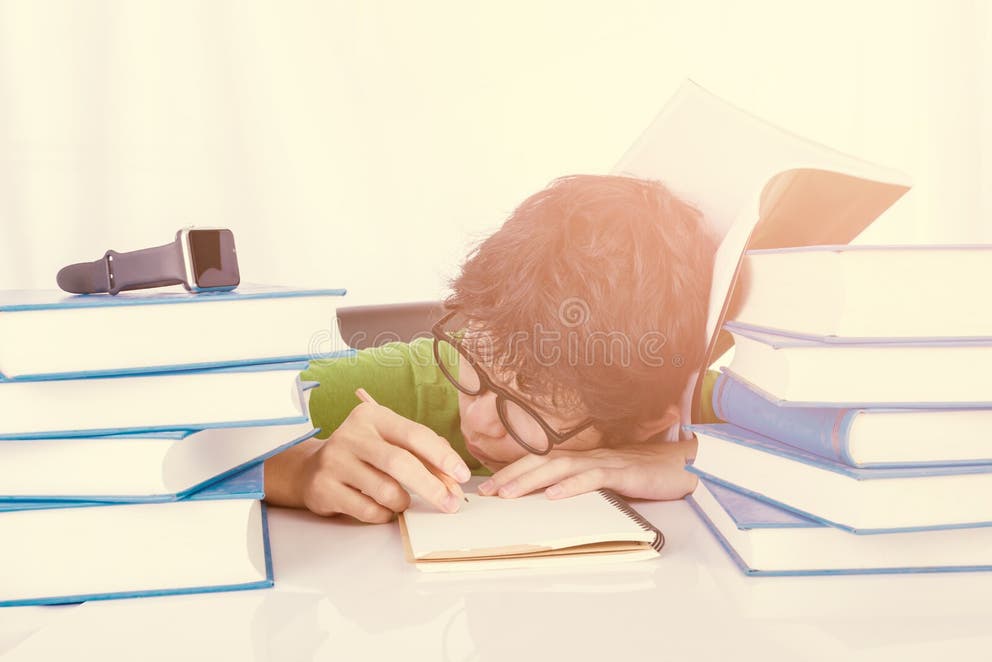 Discouraged Student Sleep at Table in Front of His Homework Stock Photo ...
