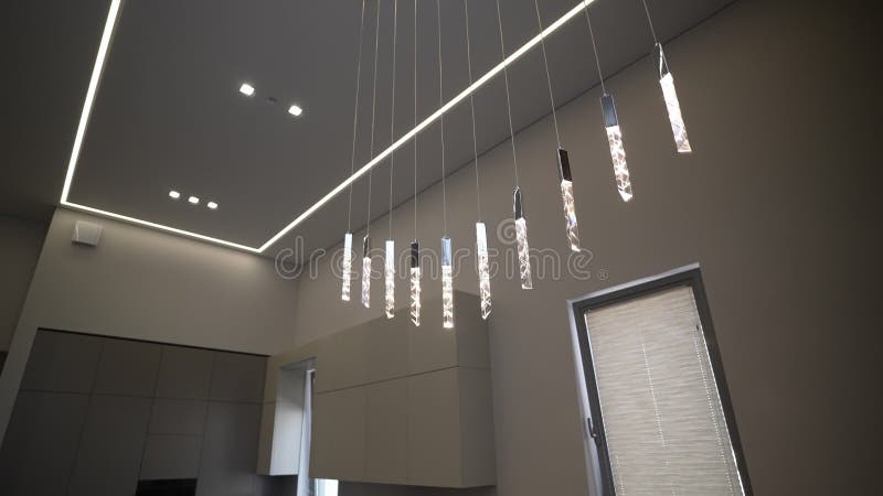 Discover Elegant Modern Lighting with a Stunning Chandelier and Ambient ...