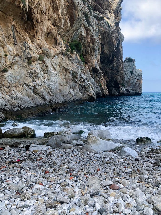 Discover the Unique Beauty of a Beach on a Rocky Ledge Stock Photo ...