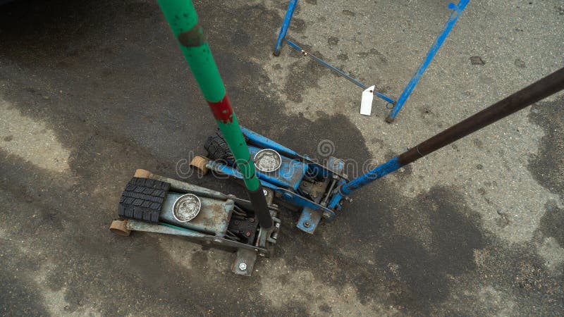 Discover Vintage Pneumatic Jacks at a Tire Change Service, Showcasing ...