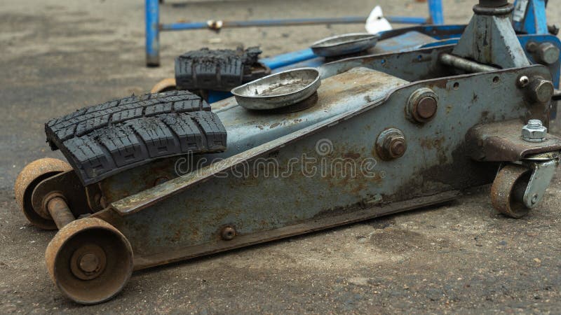 Discover Vintage Pneumatic Jacks at a Tire Change Service, Showcasing ...