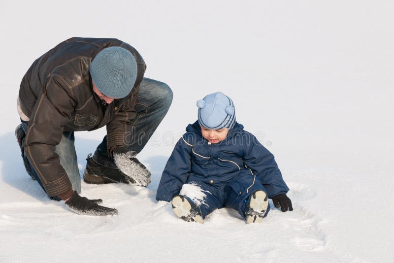 Discovering snow with dad stock photo. Image of cold - 21404366