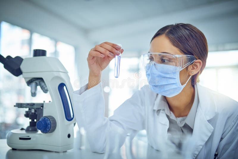 Discovering Solutions through Science. Shot of a Young Scientist ...