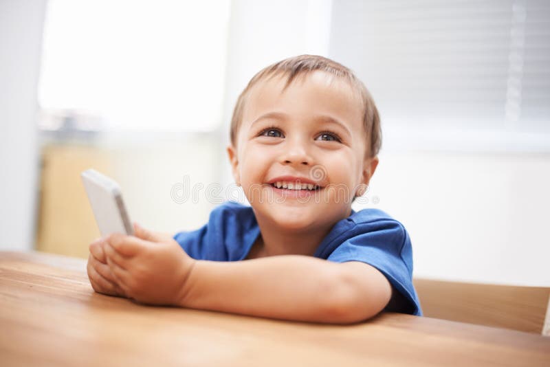 Discovering the World of Technology. a Cute Little Boy Playing with a ...