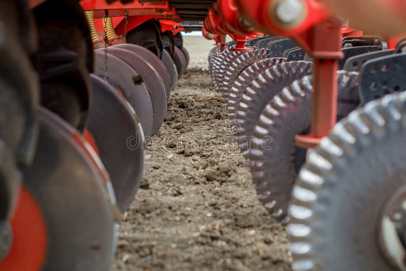 Discs Cutting the Cracks in the Ground and Spreading the Seed of a ...