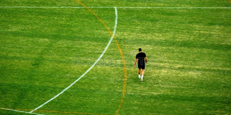 Discus Thrower Athlete for Track and Field Picking Up Disc from Green ...