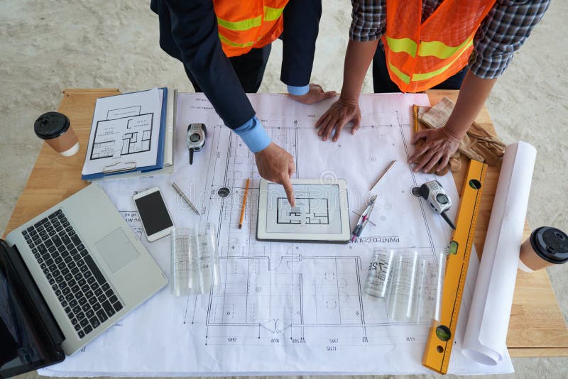 Discussing Building Blueprint Stock Image - Image of teamwork, woman ...