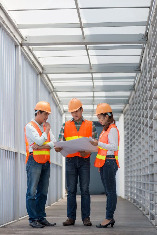 Discussing building plan stock photo. Image of looking - 56629212