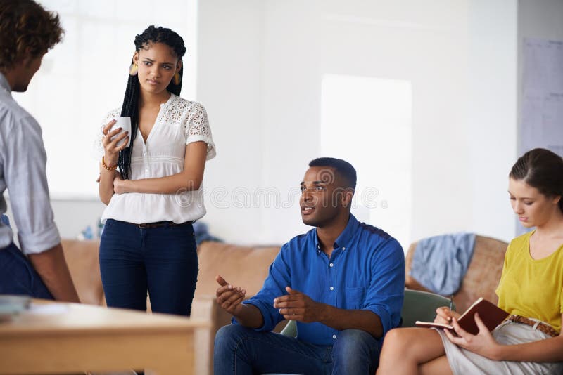 Discussing Business. a Group of Young Coworkers Discussing Work. Stock ...