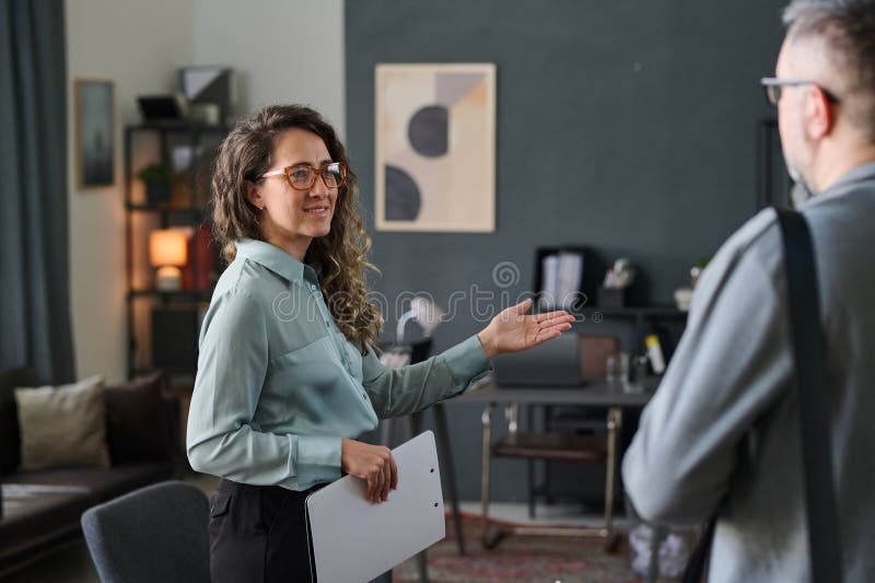 Discussing Business Strategies in Modern Office Setting Stock Image ...