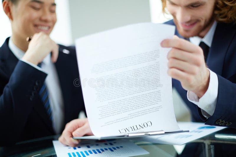 Discussing a new contract stock photo. Image of learning - 3099052