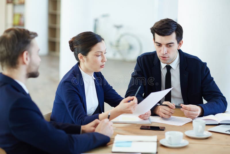 Discussing document stock image. Image of idea, economists - 91858679
