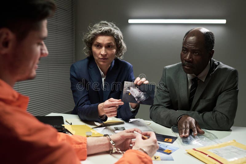 Discussing Evidence during Interrogation in Police Station Stock Image ...