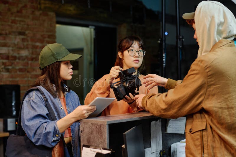 Discussing Film Project with Crew in Rustic Studio Setting Stock Image ...