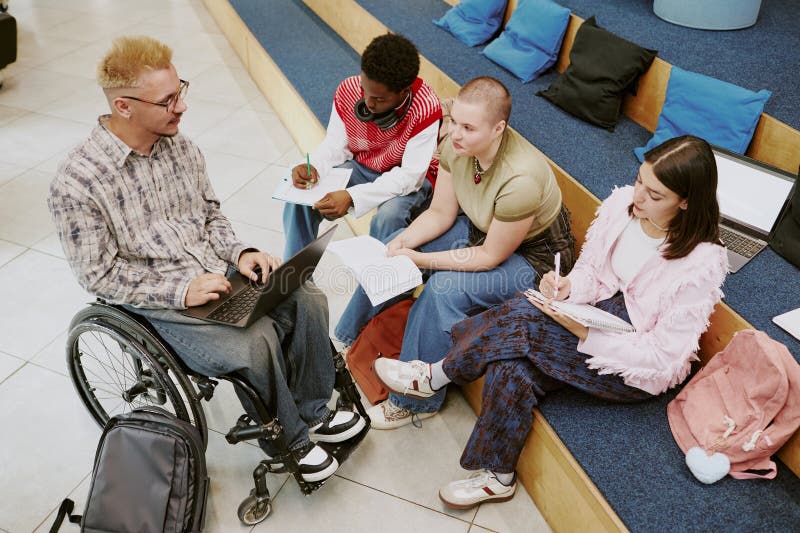 Discussing Group Project in Informal Setting on Campus Steps Stock ...
