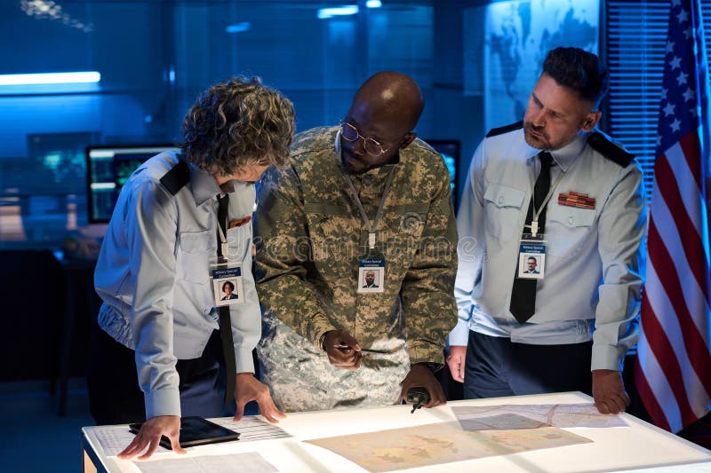 Discussing Map or Other Documents Stock Image - Image of surveillance ...