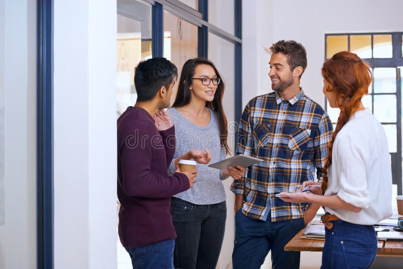 Discussing the New Designs. a Group of Young Designers Discussing Work ...