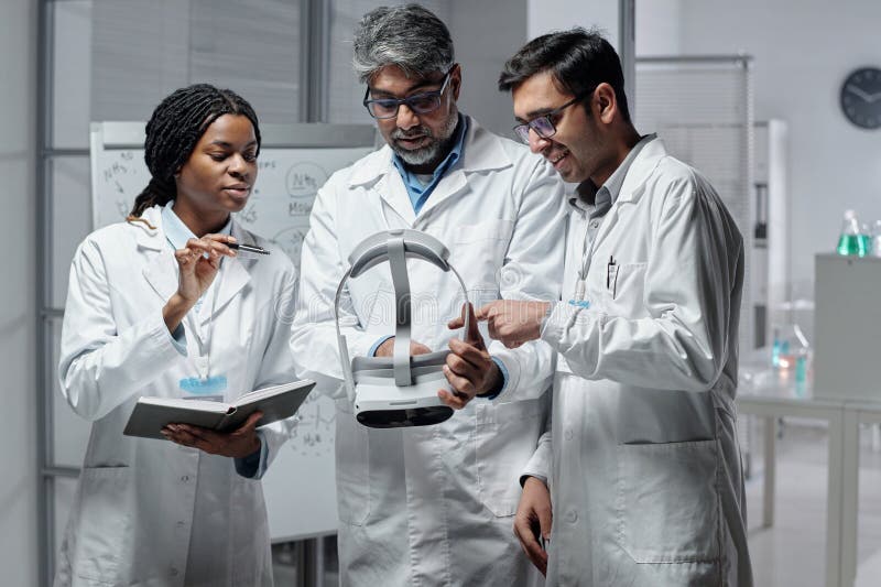 Discussing New Experimental Device in Medical Lab Stock Photo - Image ...