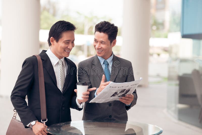 Discussing newspaper stock photo. Image of break, aged - 51655956