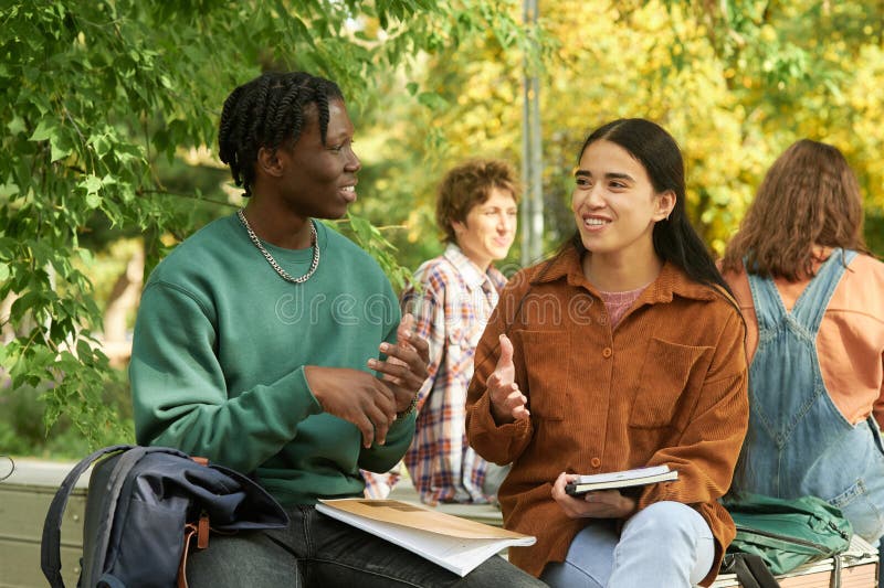 Discussing Outdoor Study Session Under Trees Stock Image - Image of ...