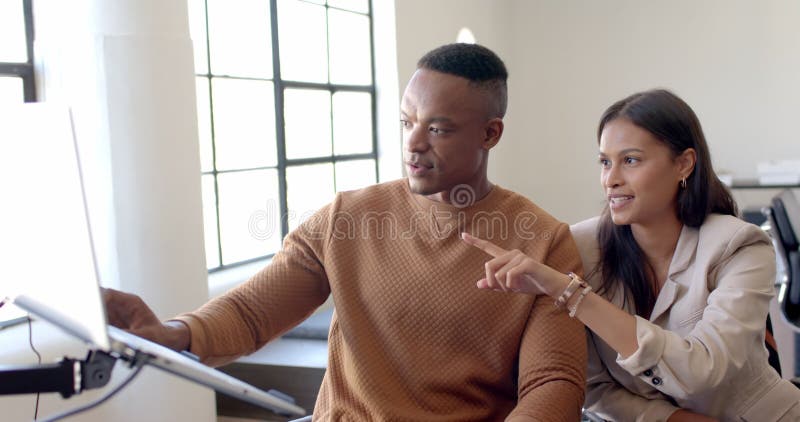 Discussing Project, Business Colleagues Collaborating and Pointing at Computer Screen Stock ...