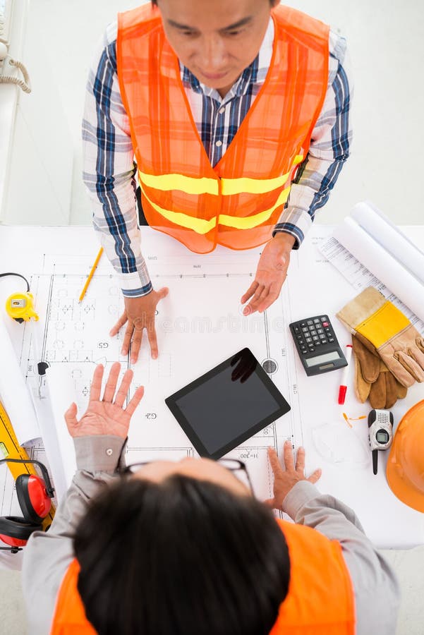Discussing project stock photo. Image of hardhat, explaining - 66462616