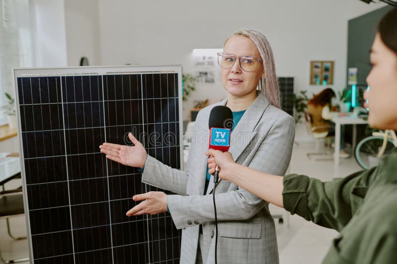 Discussing Solar Panel Technology during TV Interview Stock Image ...