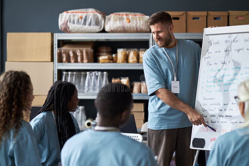 Discussing Strategy during Team Meeting with Whiteboard Stock Photo ...