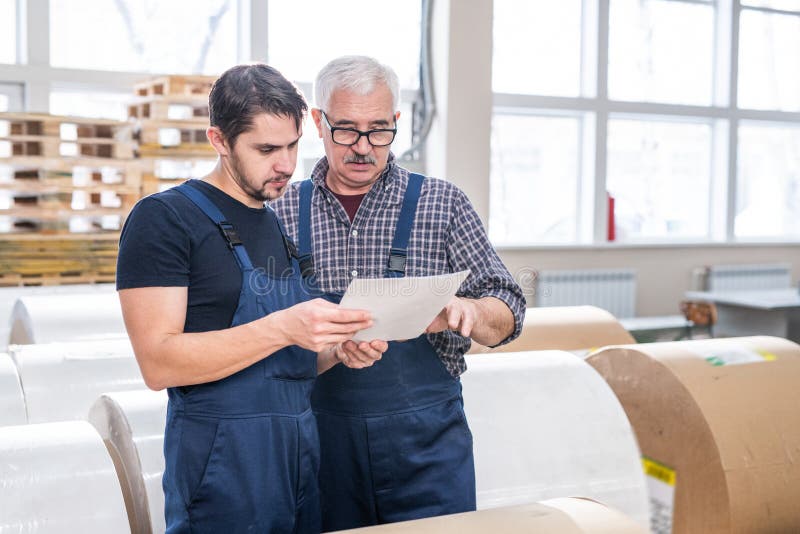 Discussing Tasks on Printing Stock Image - Image of planning, looking ...