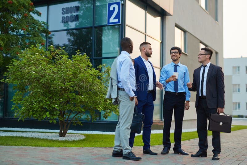 Discussion of businessmen stock photo. Image of welldressed - 76563960