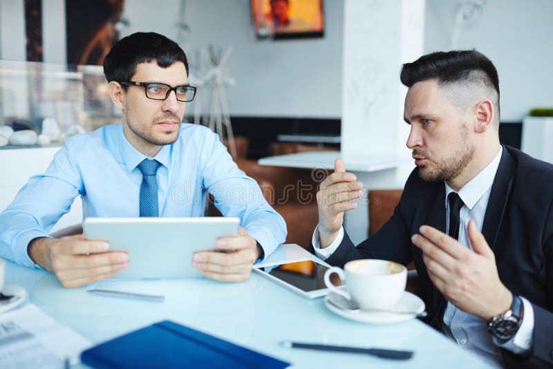 Discussion in cafe stock photo. Image of successful, handsome - 71960092