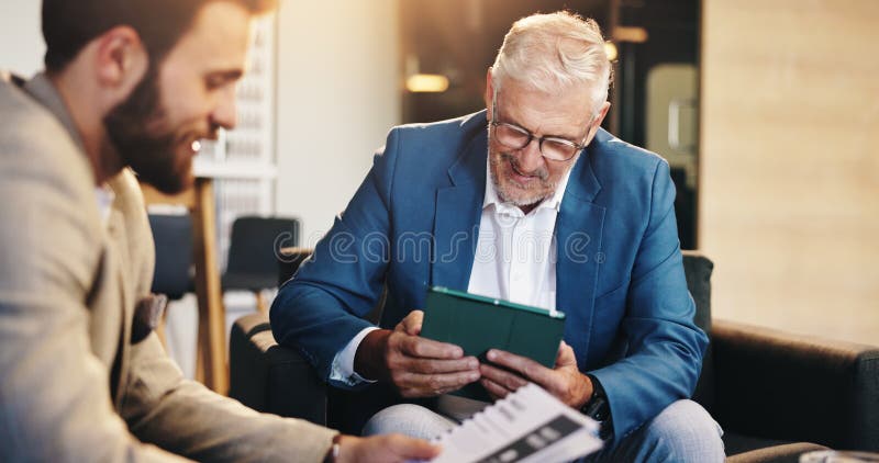 Discussion, Meeting and Tablet with Business Men in Lobby of Office for ...