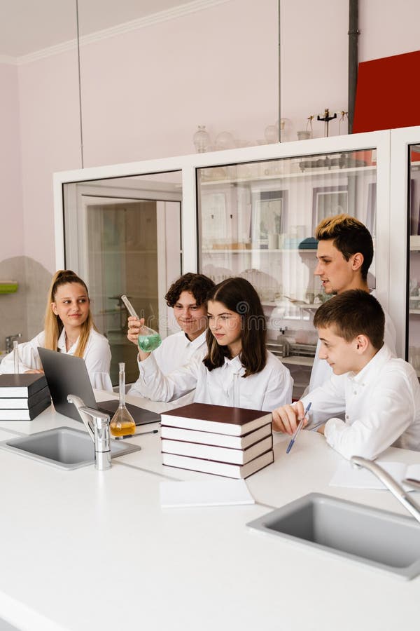 Discussion with a Teacher at a Chemistry Lesson in a Laboratory. Group ...