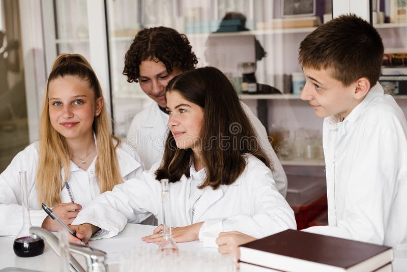 Discussion with a Teacher at a Chemistry Lesson in a Laboratory. Group ...