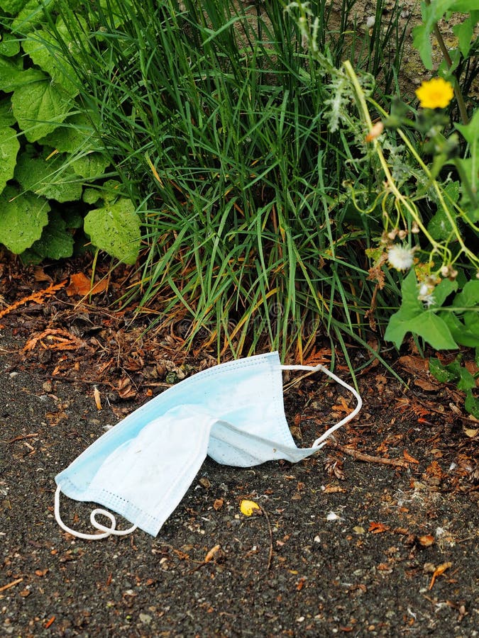 Disgarded Protective Single Use Mask Onthe Ground during the Covid-19 ...