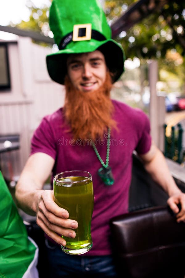 Disguised Man Holding a Green Pint Stock Image - Image of enjoyment ...
