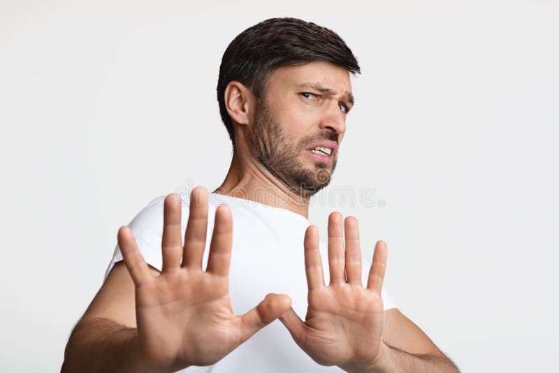 Disgusted Man Gesturing Stop Avoiding Something Over White Background ...