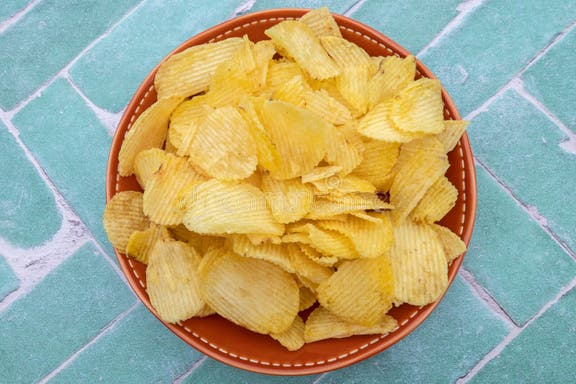 Dish of crisps on a table stock image. Image of salt - 226691011
