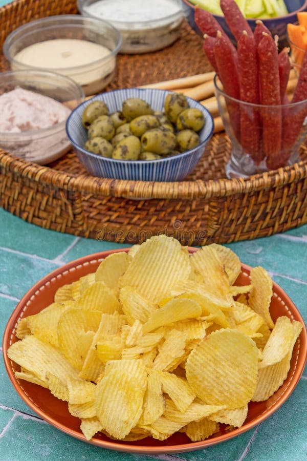 Dish of crisps on a table stock photo. Image of crisps - 226691026